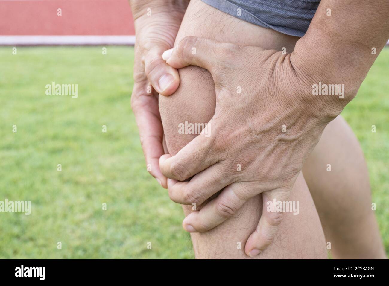 Tendon knee joint problems on Man leg from exercise In the stadium ...