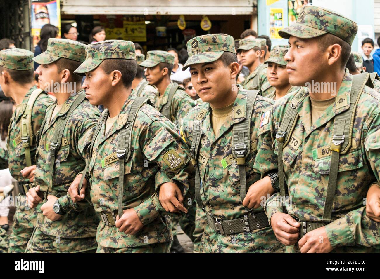 Ambato, Ecuador - Feb 15, 2015 - Army soldiers clear road by walking ...