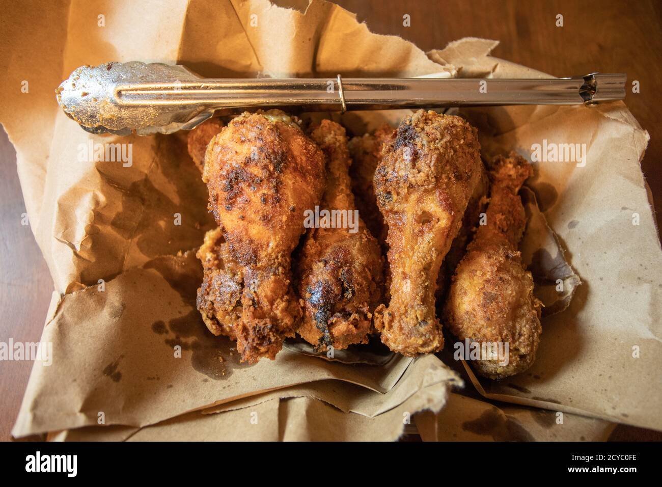 Fried chicken on brown paper Stock Photo - Alamy