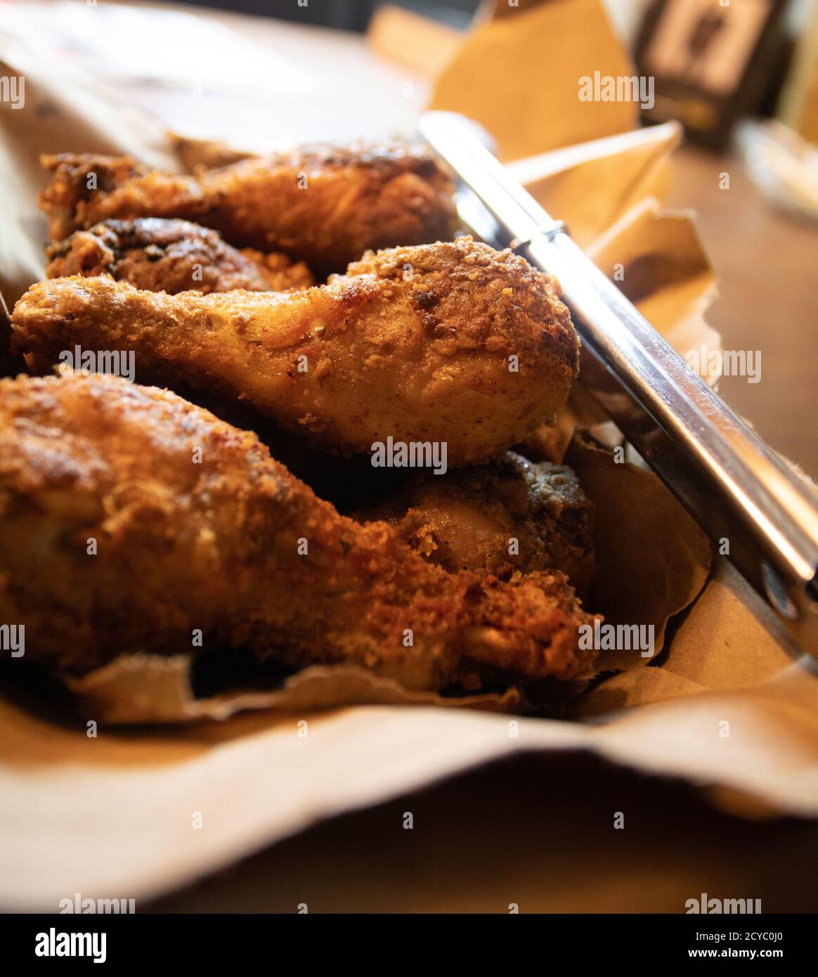Fried chicken on brown paper Stock Photo - Alamy