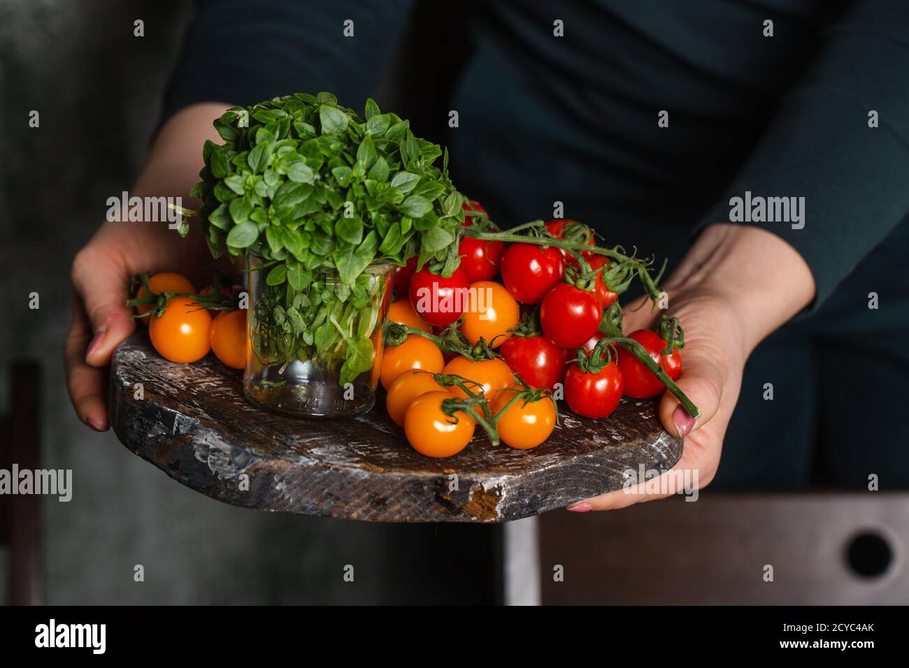 Tray with a variety of food in the hands of a girl close-up Stock Photo ...
