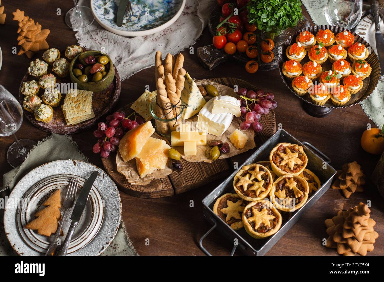 New year, christmas or festive table table with food top view. 2021 ...