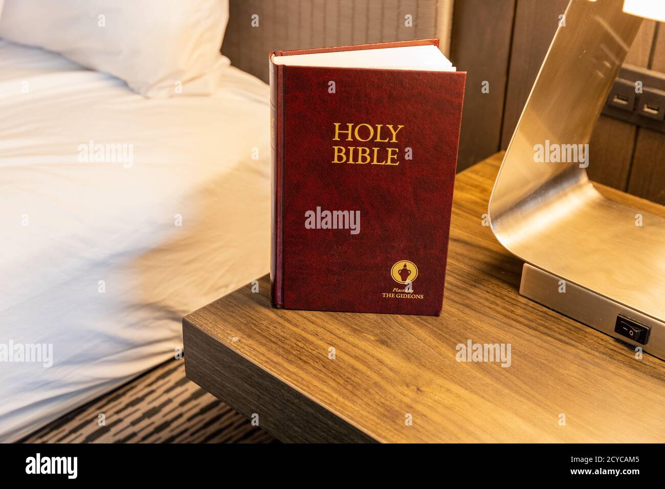 Gideons Bible in hotel room on bedside table Stock Photo - Alamy