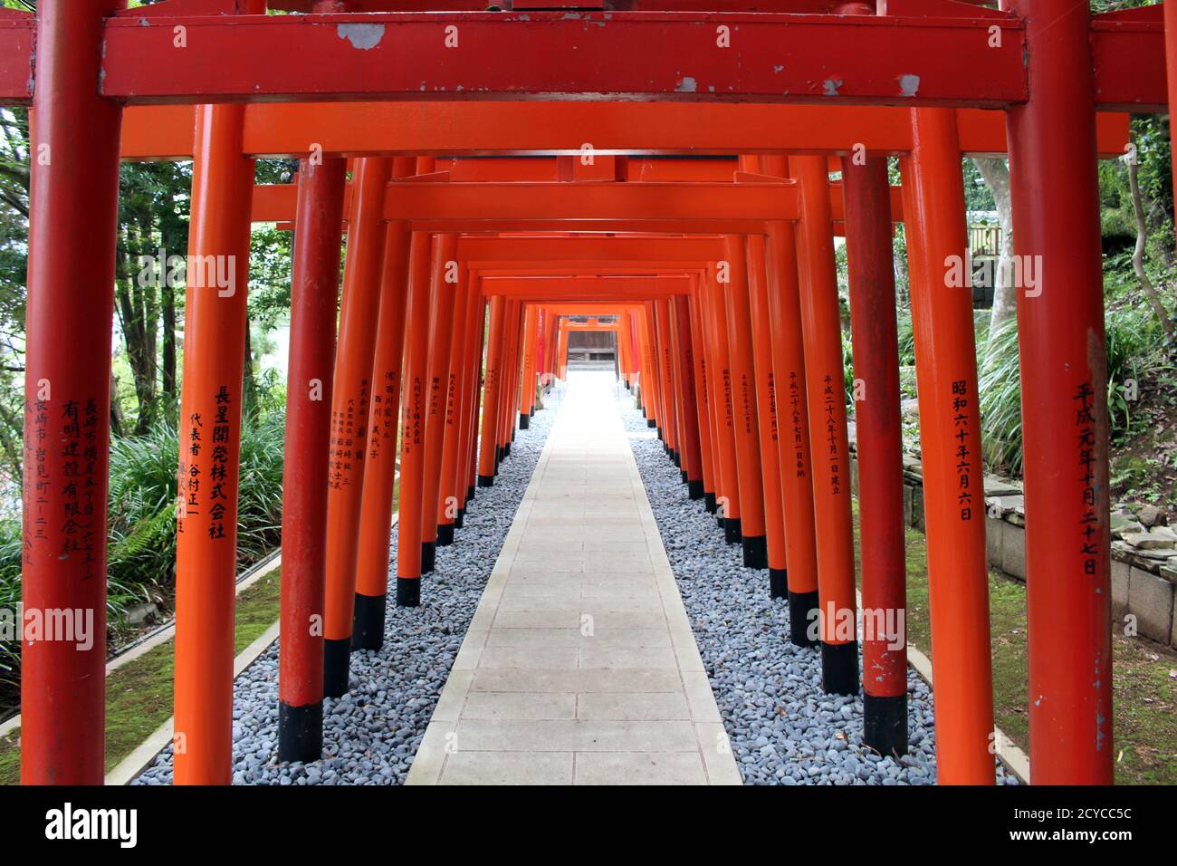 Line of orange torii gates at inari jinja of at Suwa Shrine in Nagasaki ...