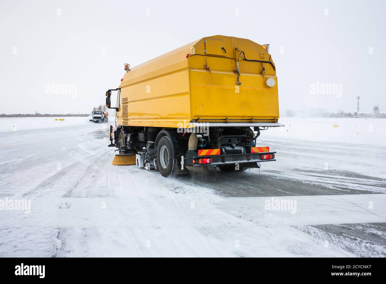 Airfield sweeper-vacuum machines clean Runway Stock Photo - Alamy