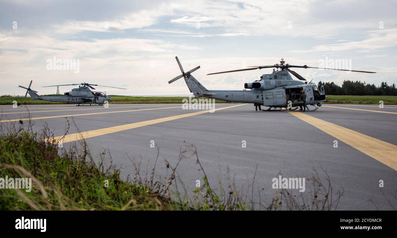 A U.S. Marine Corps UH-1Y Venom helicopter (right) and an AH-1Z Viper ...