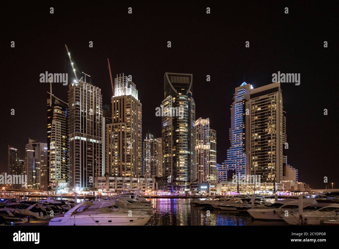 DUBAI, UAE, MAR 20, 2018: Skyscrapers line the marina in Dubai at night ...