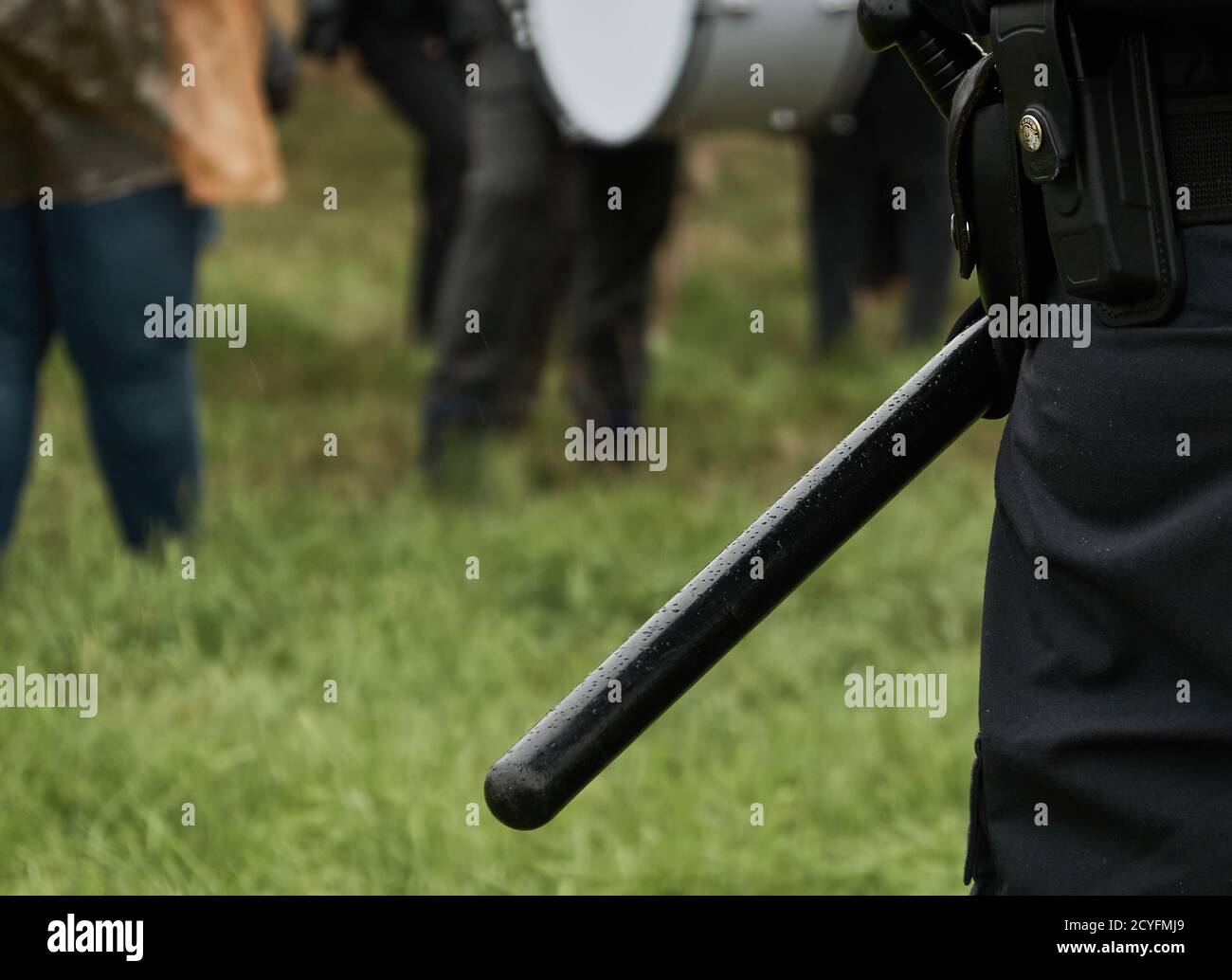 Baton on the belt of the black uniform of a German police officer Stock ...