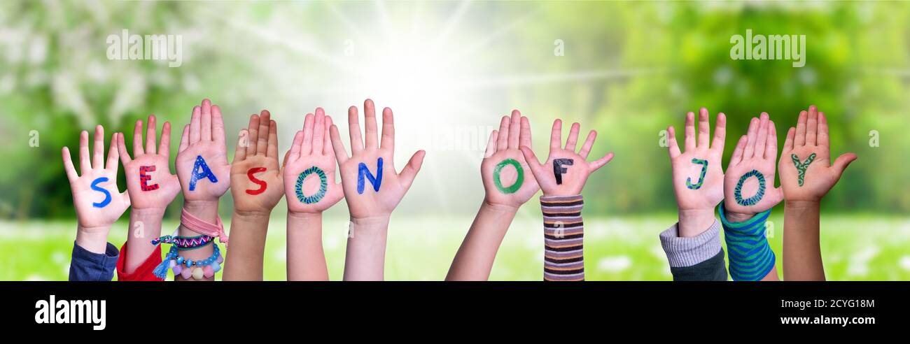 Children Hands Building Word Seasons Of Joy, Grass Meadow Stock Photo ...
