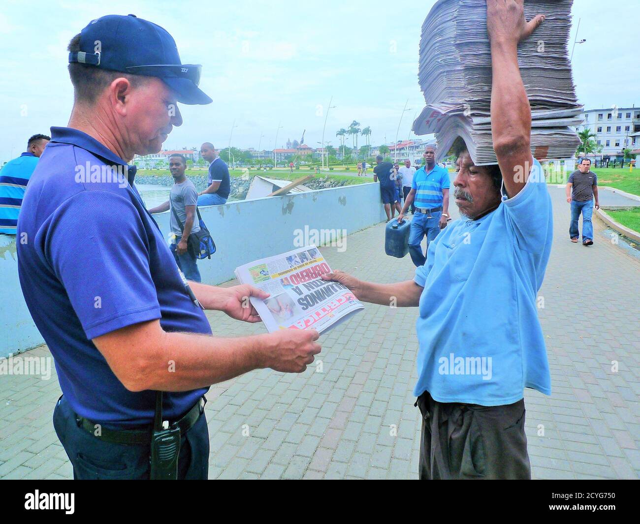 A NEWSPAPER SELLER ON A STREET Stock Photo - Alamy
