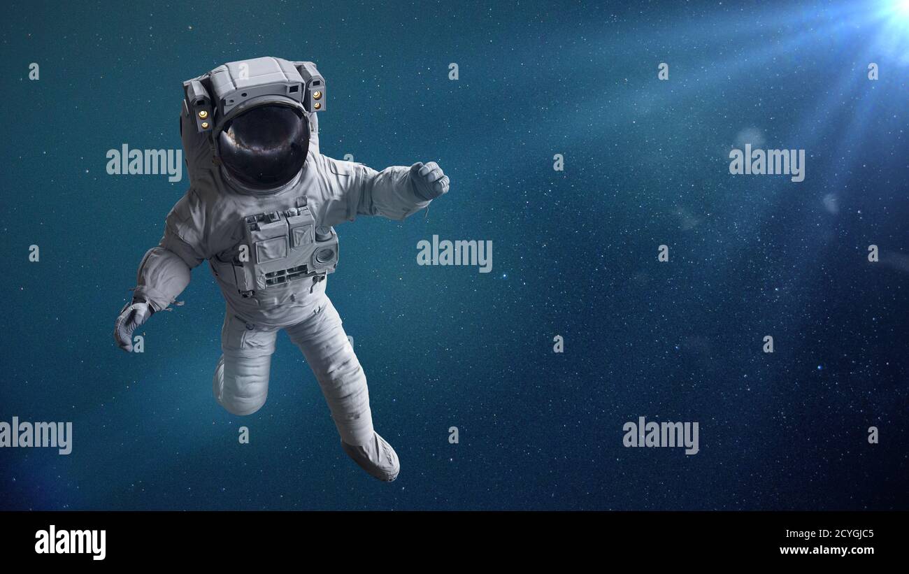 astronaut in empty space lit by the stars Stock Photo - Alamy