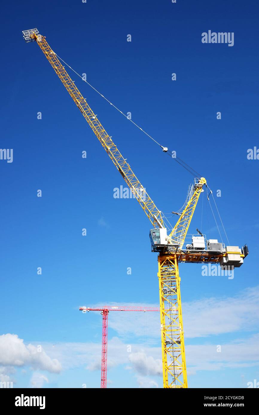 Two yellow jib cranes hi-res stock photography and images - Alamy