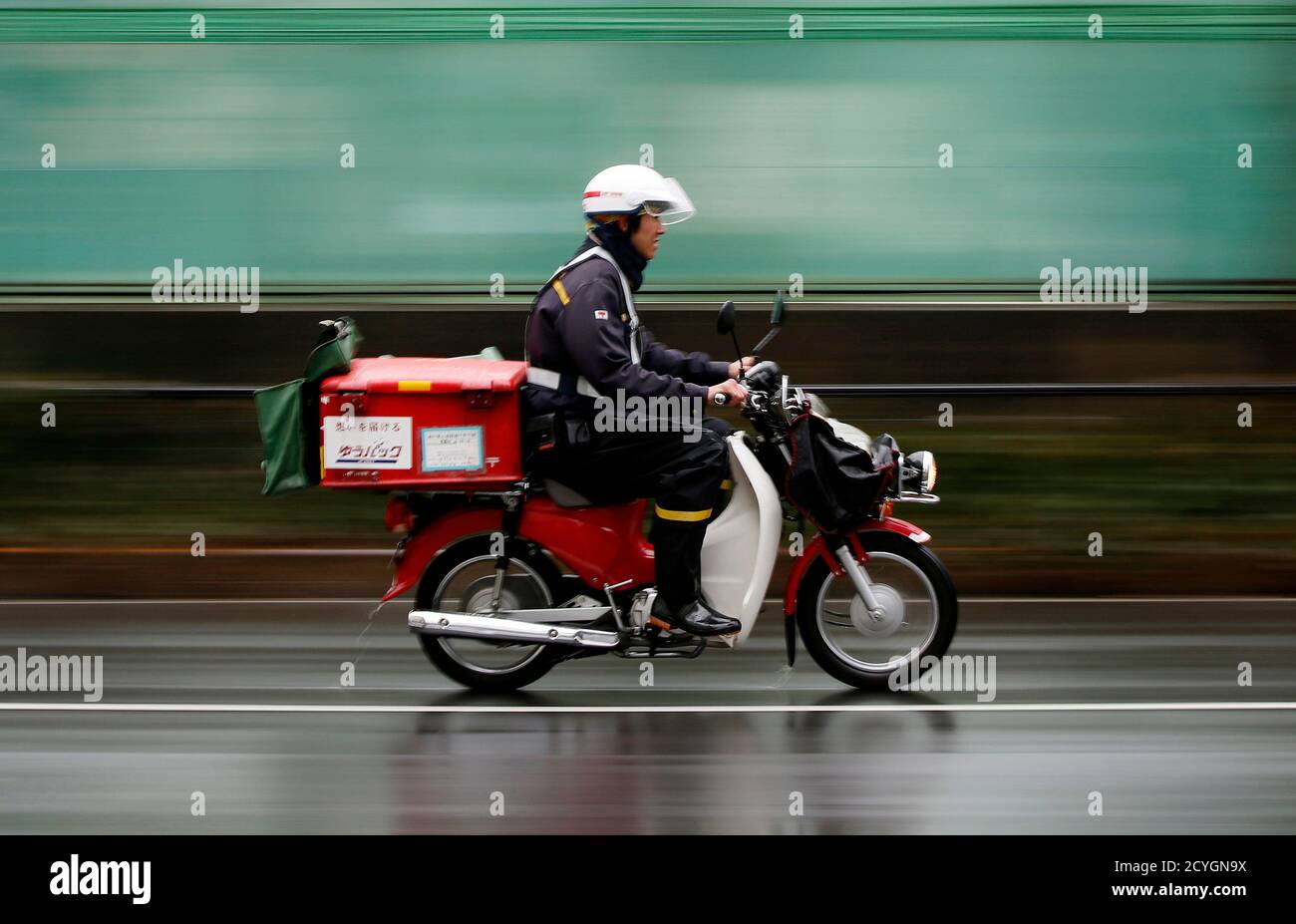 Postman rides hi-res stock photography and images - Alamy