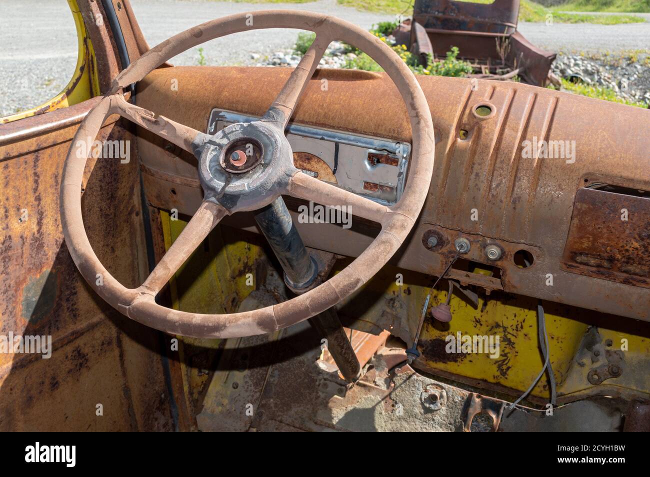 The rusty interior and steering wheel of an antique truck Stock Photo ...