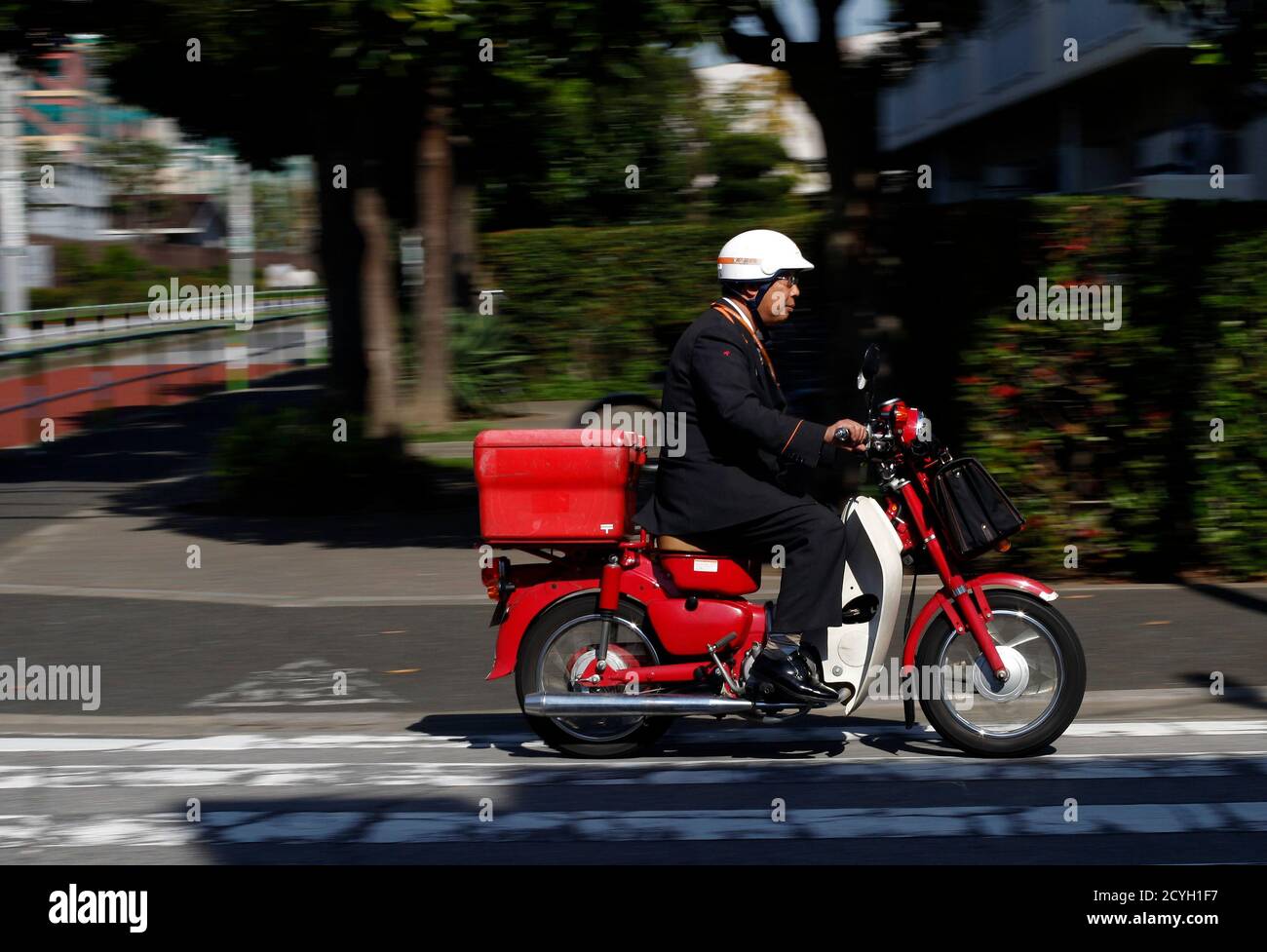 Postman rides hi-res stock photography and images - Alamy