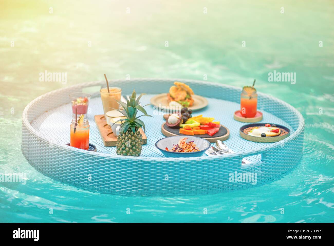 delicious Breakfast on the floating table in the pool.tint ...