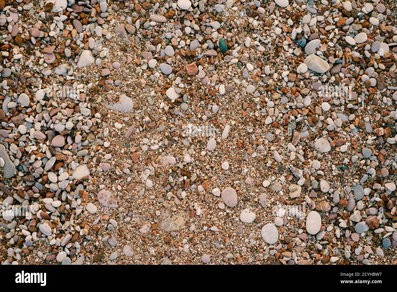 Background Sea pebbles and sand on the beach, texture close-up Stock ...