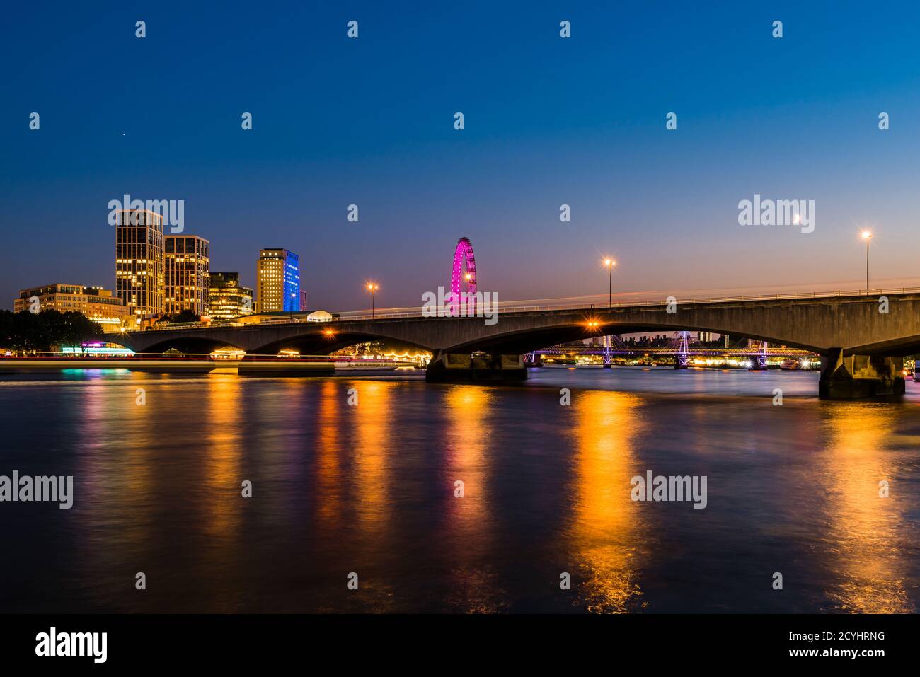 Lights on the river around Waterloo Bridge at dusk, Westminster, London ...