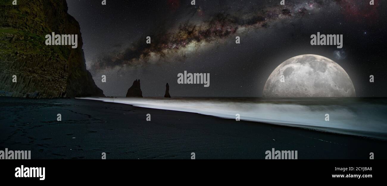 Fantastic landscape with a giant moon against the backdrop of a ...