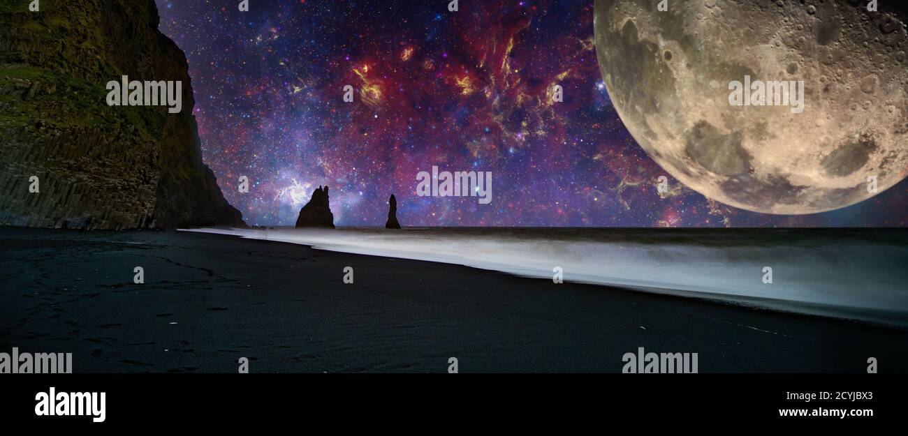 Fantastic landscape with a giant moon against the backdrop of a ...