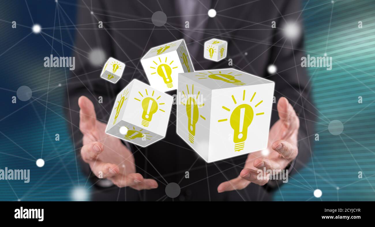 Idea concept above the hands of a man in background Stock Photo - Alamy