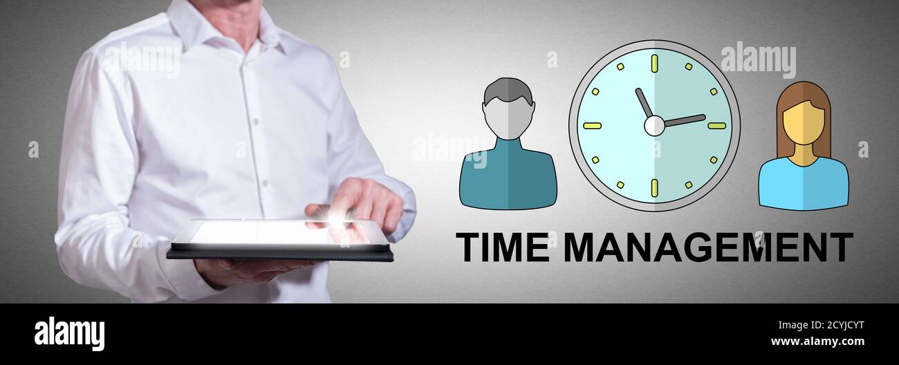 Man using a tablet with time management concept Stock Photo - Alamy