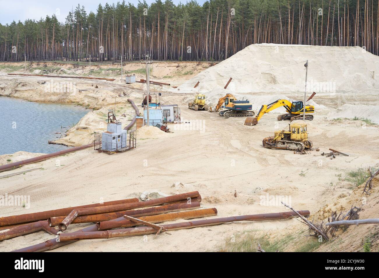 Sand quarry mining industry equipment excavator tractor standing sand ...