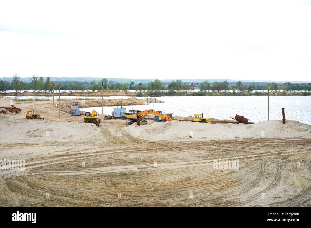 Sand quarry mining industry equipment excavator tractor standing sand ...