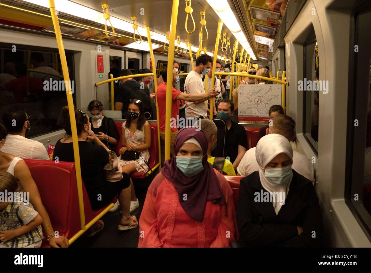 People and commuters traveling on subway train in Vienna, Austria ...