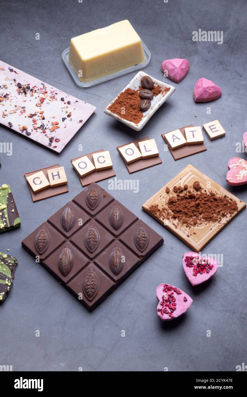 assorted colorful chocolate bar. Sweets dessert of various black milk ...