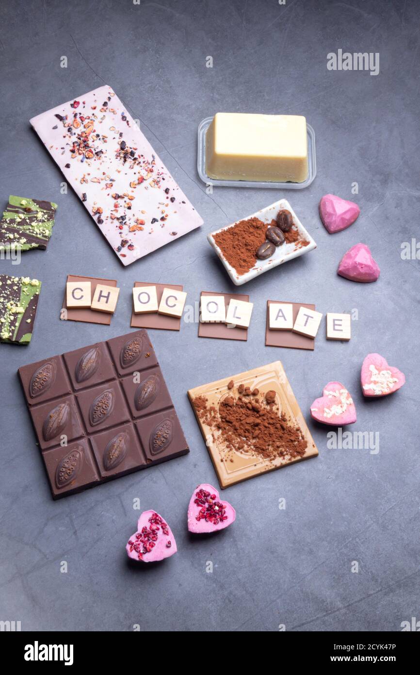 assorted colorful chocolate bar. Sweets dessert of various black milk ...