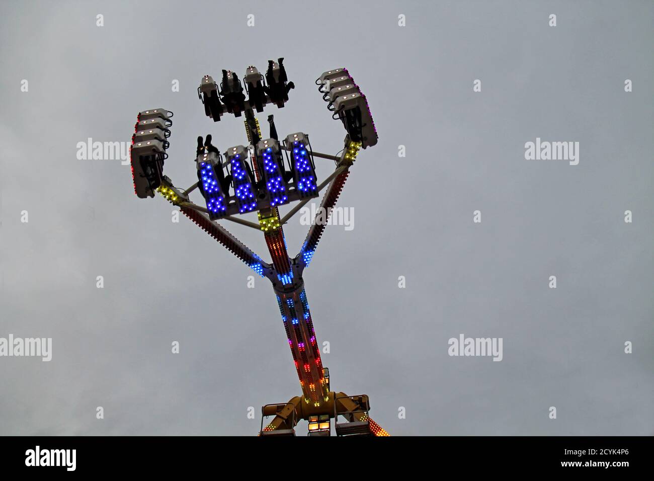 A High Flying Fun Fair Ride with Lights at Dusk Time Stock Photo - Alamy