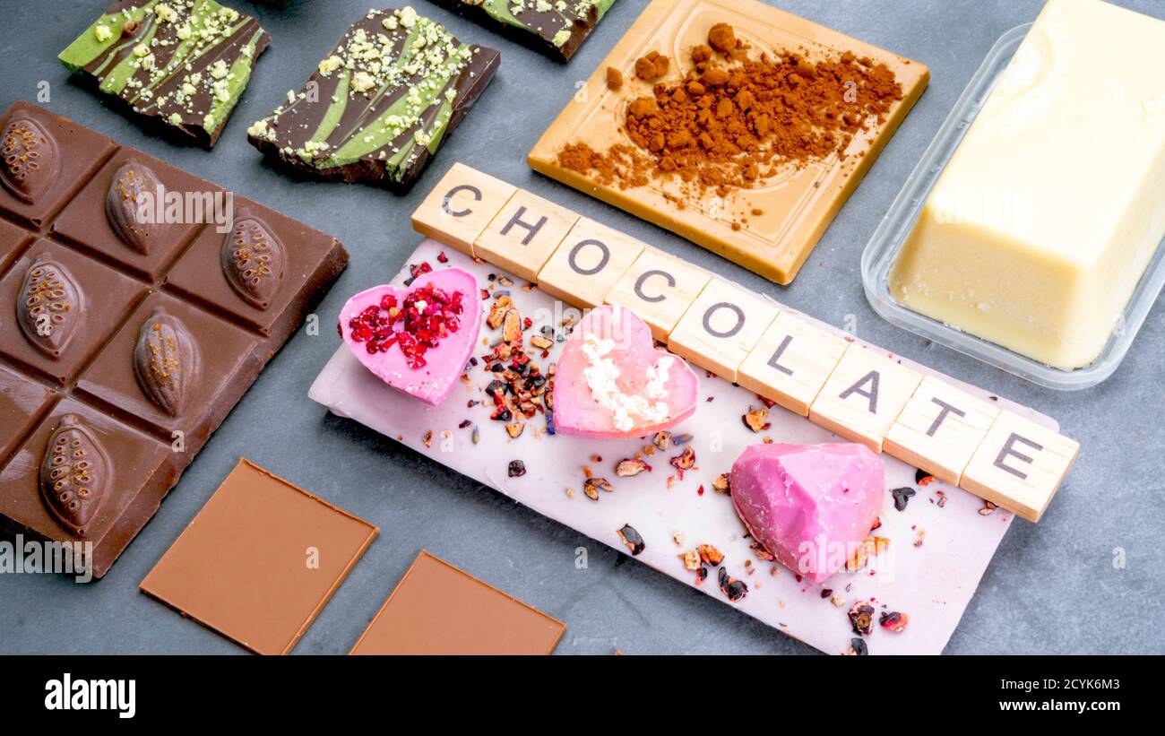 assorted colorful chocolate bar. Sweets dessert of various black milk ...