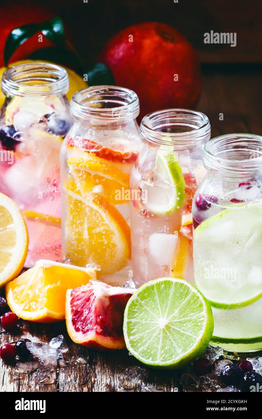 Fizzy water with citrus fruit, fresh berries and crushed ice, vintage ...