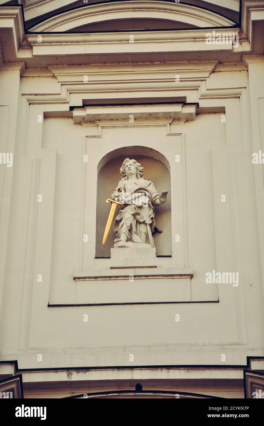 Wien, Austria - Statue in marble with gold sword in a building. Details ...