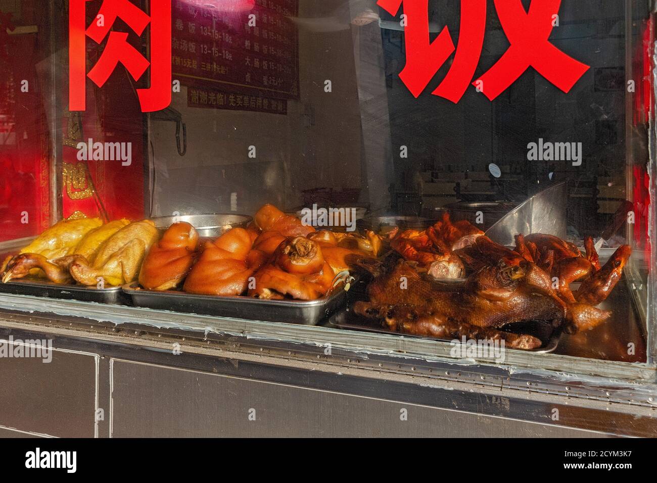 Showcase with street food in China. Fried meat on counter in. Photo ...