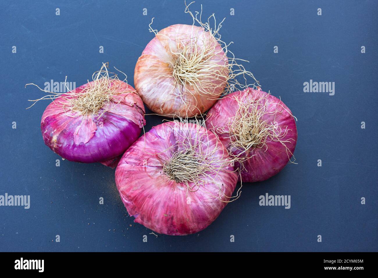 Close up of giant pink onions Stock Photo - Alamy