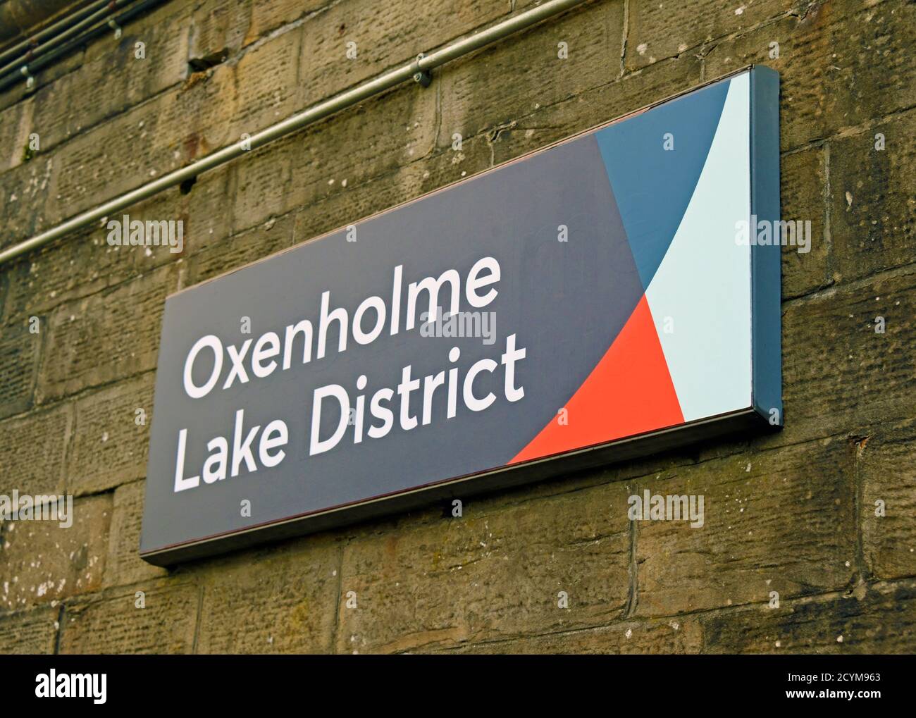 Station nameboard. Oxenholme Lake District rail station, West Coast ...