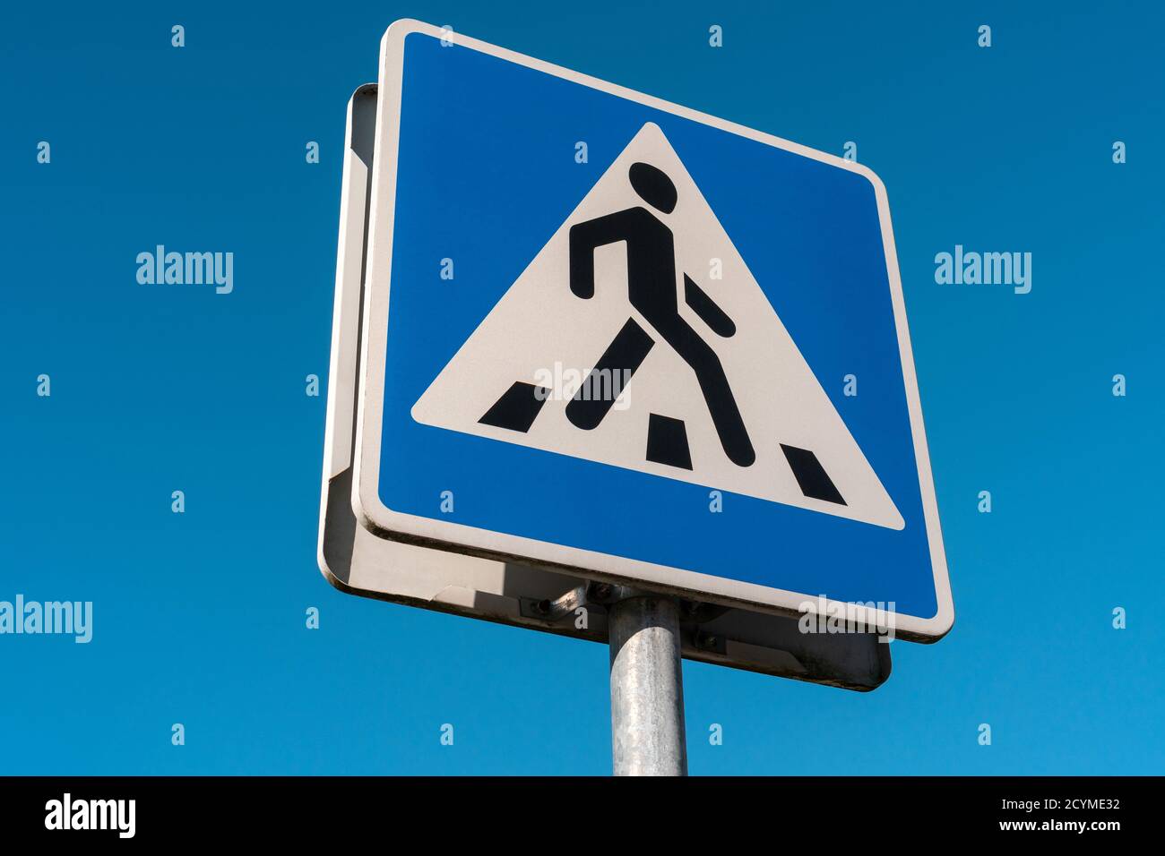 Road sign pedestrian. Pedestrian transit traffic sign on blue sky ...