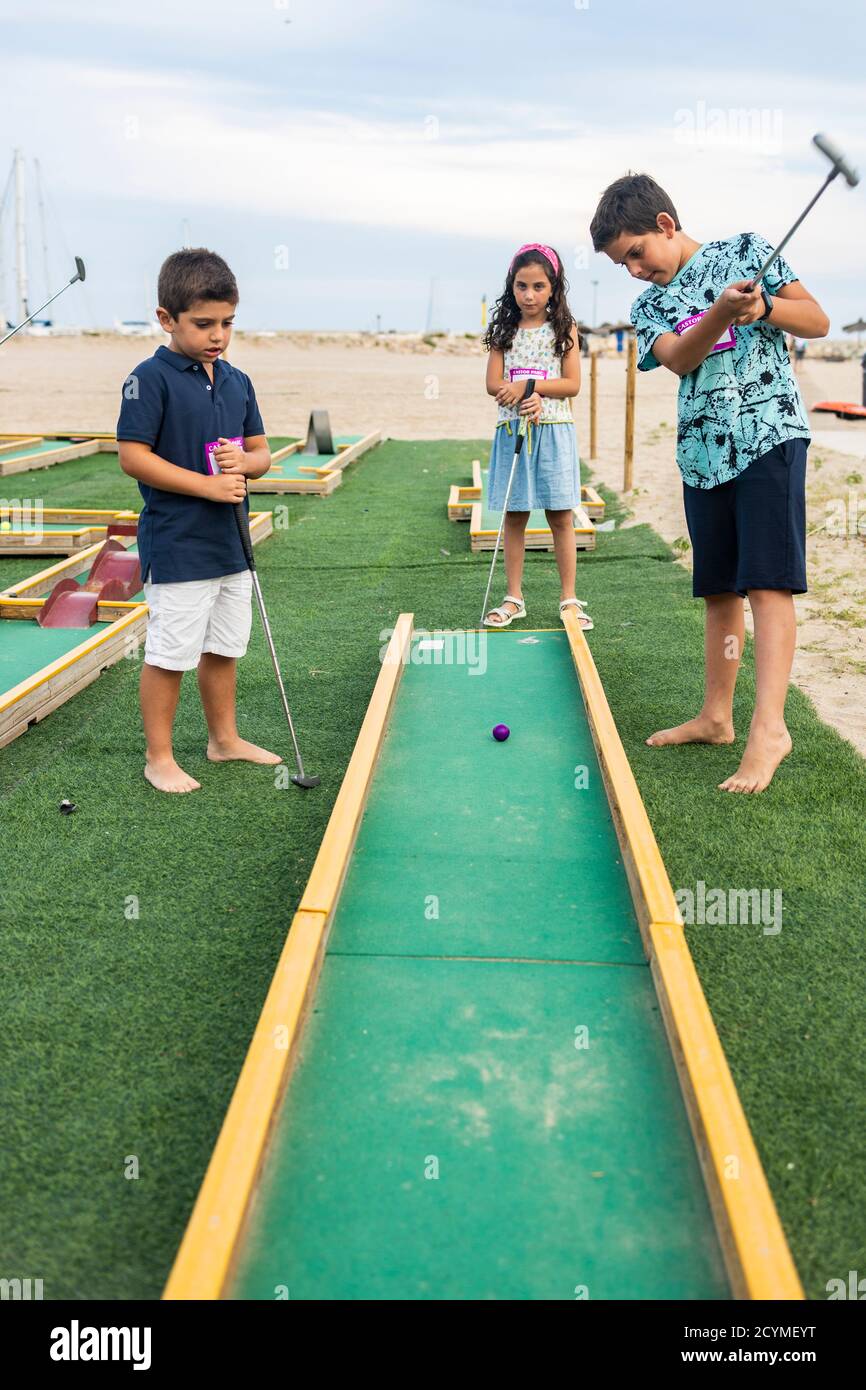 Children playing mini golf Stock Photo - Alamy
