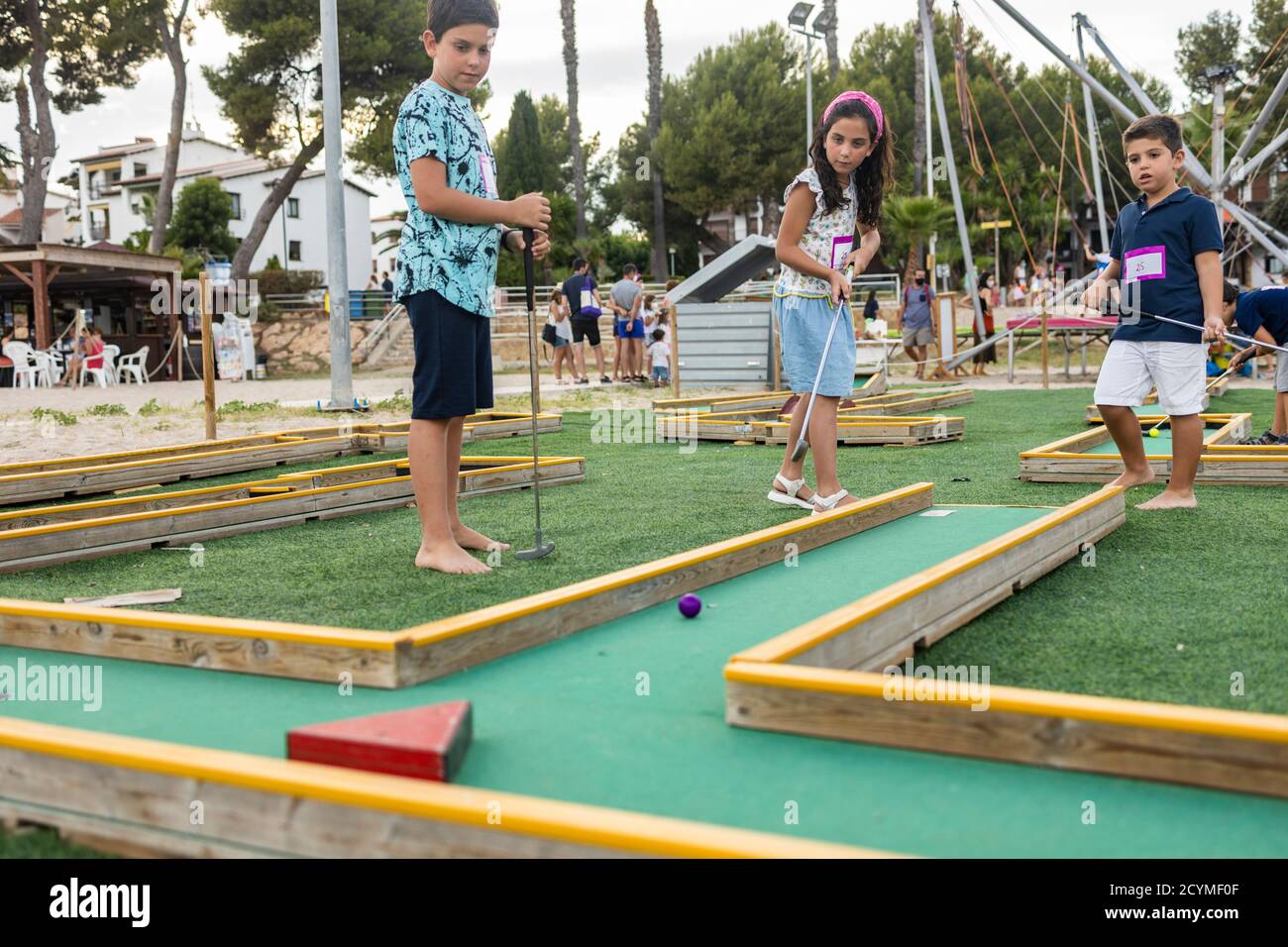 Children playing mini golf Stock Photo - Alamy