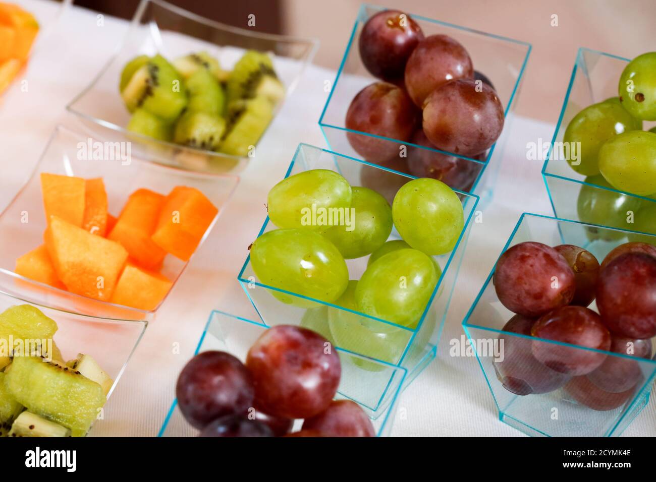 fruit buffet with single portions and cut fruit melon peach apple pear ...