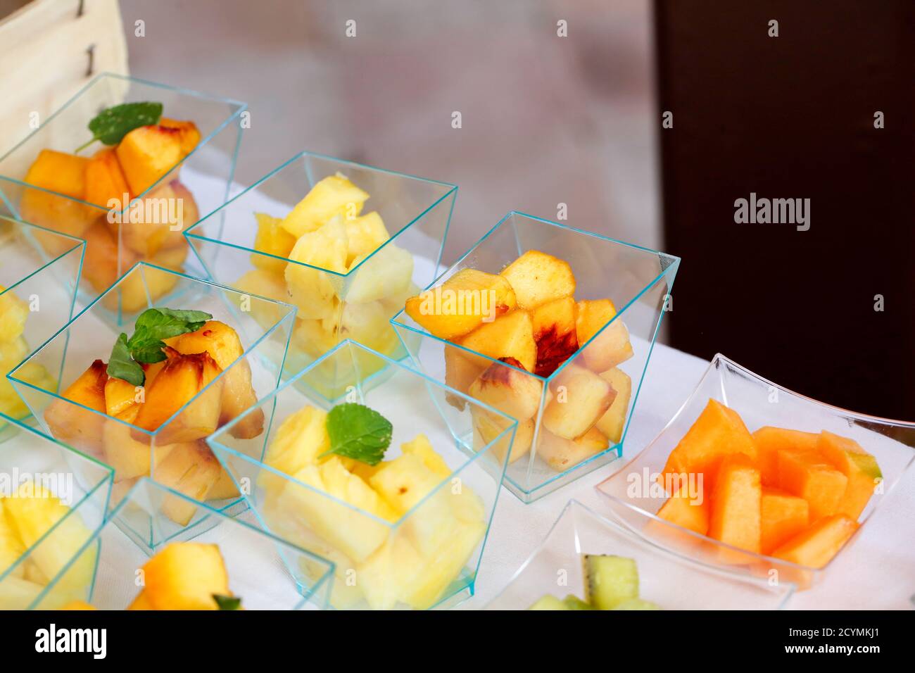 fruit buffet with single portions and cut fruit melon peach apple pear ...