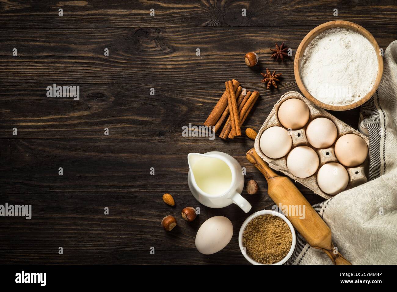 Baking ingredients on kitchen table Stock Photo - Alamy