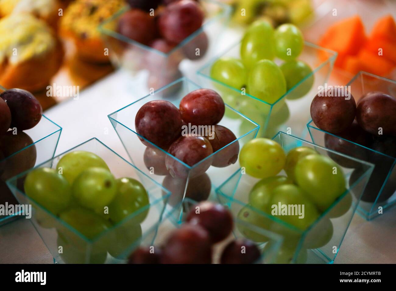 fruit buffet with single portions and cut fruit melon peach apple pear ...