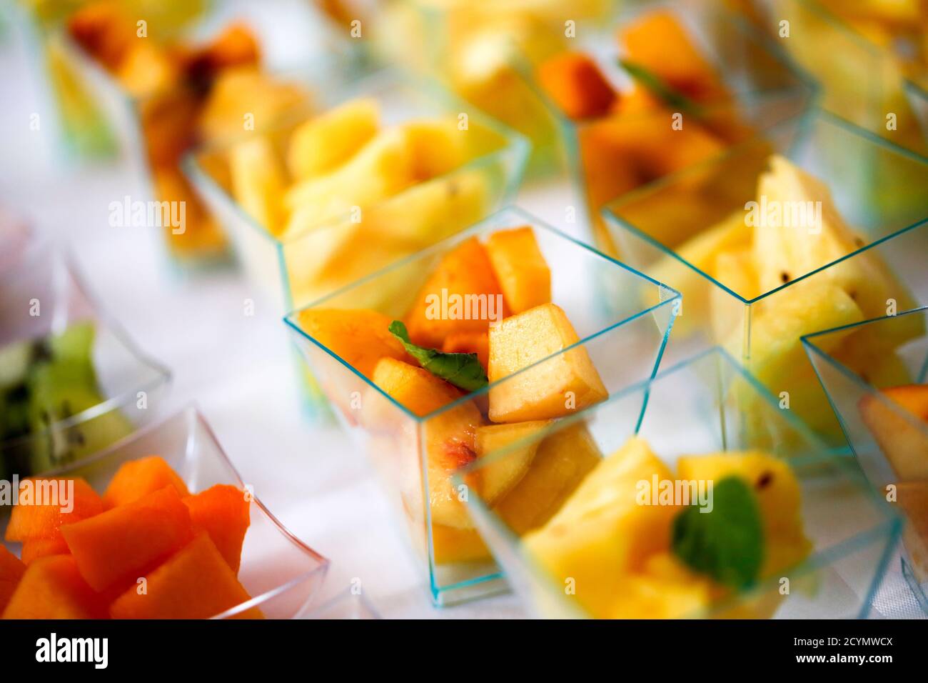 fruit buffet with single portions and cut fruit melon peach apple pear ...