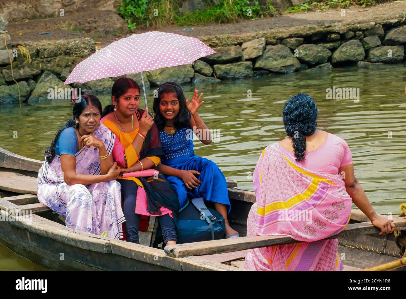 Women & girl on boat on the backwaters - a historic spice & rice boat ...