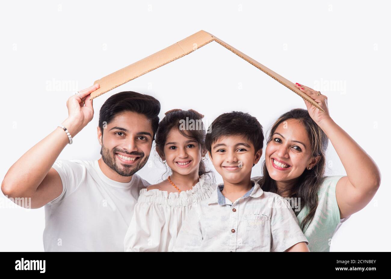 Indian family Father, mother, son and daughter holding 3D paper model ...