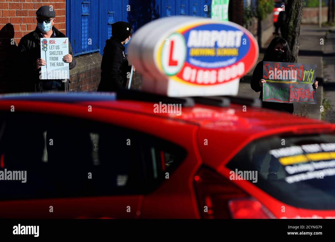 Driving instructors and their supporters take part in a protest outside ...