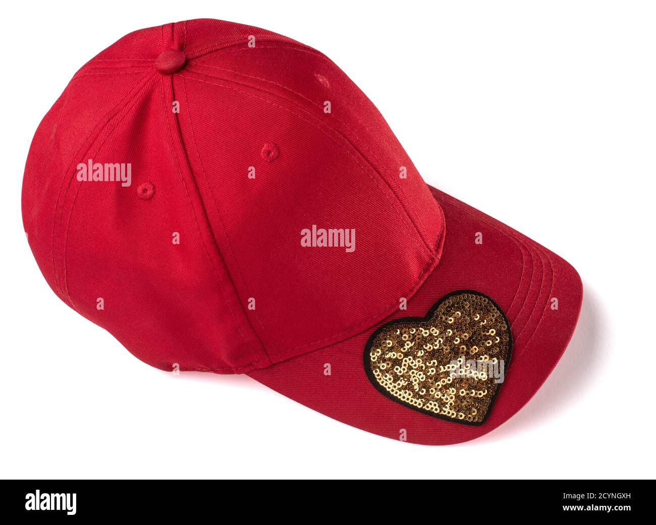 Red cap with golden sequin heart patch on white background Stock Photo ...